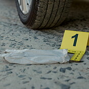Crime scene, evidence and label on ground for criminal, forensic or ...