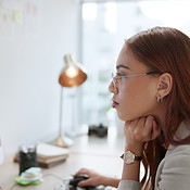 Business, thinking and woman with ideas, desktop and online reading for ...