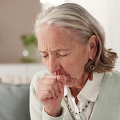 Sick, cough and senior woman in home with asthma or pneumonia, lung ...