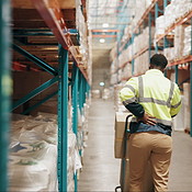 Warehouse, shipping and man with back pain, burnout and overworked with ...