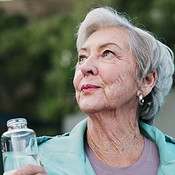 Thinking, fitness and senior woman outdoor with location for walking ...