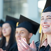 Happy people, graduation and ceremony with applause in congratulations ...