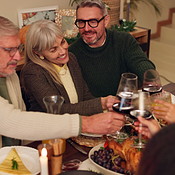 Happy family, toast and dinner for thanksgiving in home with love, food ...