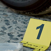 Crime scene, evidence and forensic investigation on road with label for ...