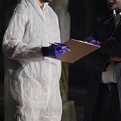 Forensic, detective and documents with discussion at crime scene for ...