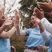 Clapping hands, high five and volunteers in outdoor park with ...
