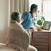 Caregiver, senior woman and relax in bedroom with blanket, nostalgia memory or partner loss of ...