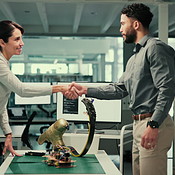 Woman, man and shaking hands at meeting for prosthetic design, blade or ...