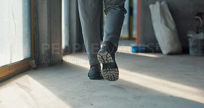 Construction, worker and legs of person walking for project ...