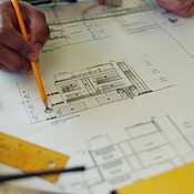 Hands, architect and blueprint with drawing for construction layout ...