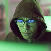 Office, hacking and man in information technology with computer for ...