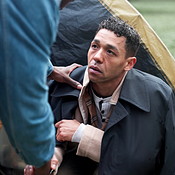 Poverty, begging and man in tent with handshake for asking for donation ...