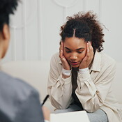 Therapy, consultation and woman with stress in office for trauma ...