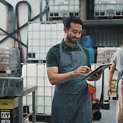 Checklist, factory and distillery with man and tablet for distribution ...