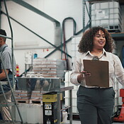 Checklist, factory and distillery with woman and clipboard for ...