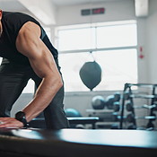 Cleaning, spray and bench with man in gym for disinfection, sanitary ...