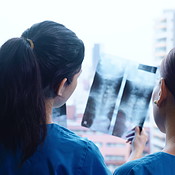 Doctors, women and xray on window for healthcare, patient results and ...