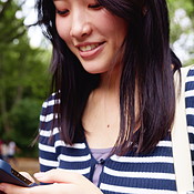 Japanese woman, typing and phone outdoor with communication ...