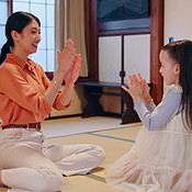 Japanese woman, child and clapping game in home for learning ...