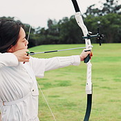 Archery, aim and woman with outdoor shooting, target practice and ...