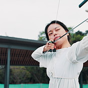 Shooting, aim and woman with archery training, target practice and ...
