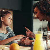 Breakfast, home or mom talking to kid for love, development or warning for teaching lesson in ...