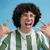 Man, dancing and rocker face with music, rock hands and listening with ...