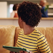 Crisis, parents and tablet with kid on sofa for marriage fight, child neglect and divorce ...