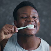 Dental health, hygiene and face of black man brushing teeth in bathroom ...