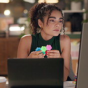 Office, woman and computer at night with fidget toy for stress or ADHD ...