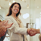 Team clapping, shaking hands and business woman with deal, praise and ...