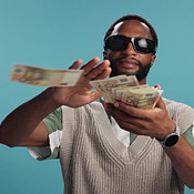 Black man, cash and blowing money with sunglasses for financial freedom ...