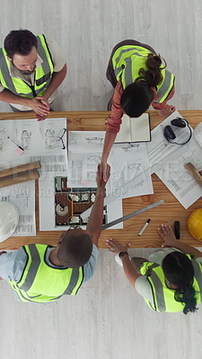 Architecture, handshake and above of people with blueprint for design ...