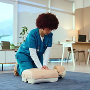 Woman, cpr dummy and nurse training, medical student and learning ...