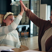 High five, mom and girl in kitchen with homework, success and happy achievement in education ...