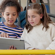 Tablet, playing and children on bus for travel together with ...