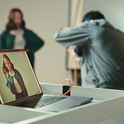 Backstage, laptop screen and photography with people in studio for ...