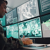 Soldier, man and computer screen for military safety, battle location and monitoring war. Army ...