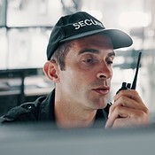 Man, security guard and radio with surveillance check for safety ...
