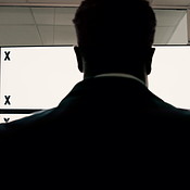 Tracking markers, mockup space and back of man by computer screen ...