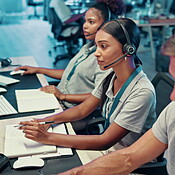 People, headset and check on computer in control room to monitor ...