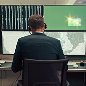 People, computer and screen of maps in control room, monitor weather ...