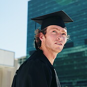 Student, graduation or man with thinking outdoor for academic milestone ...