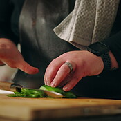 Hands, person and wrist pain in kitchen for cutting, inflammation ...