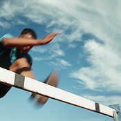 Man, running and jump for hurdle outdoor of fitness competition, run ...