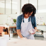 Woman, workshop and checklist with pottery, inventory and product ...