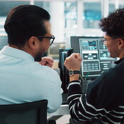 Computer, colleagues and men with fist bump, smile and celebration for ...
