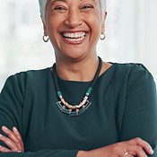 Happy, crossed arms and face of mature businesswoman in office with ...