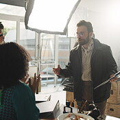 Advice, movie and director with actress on film set for scene rehearsal ...