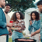 BBQ, conversation and sausage with friends in backyard of home together ...